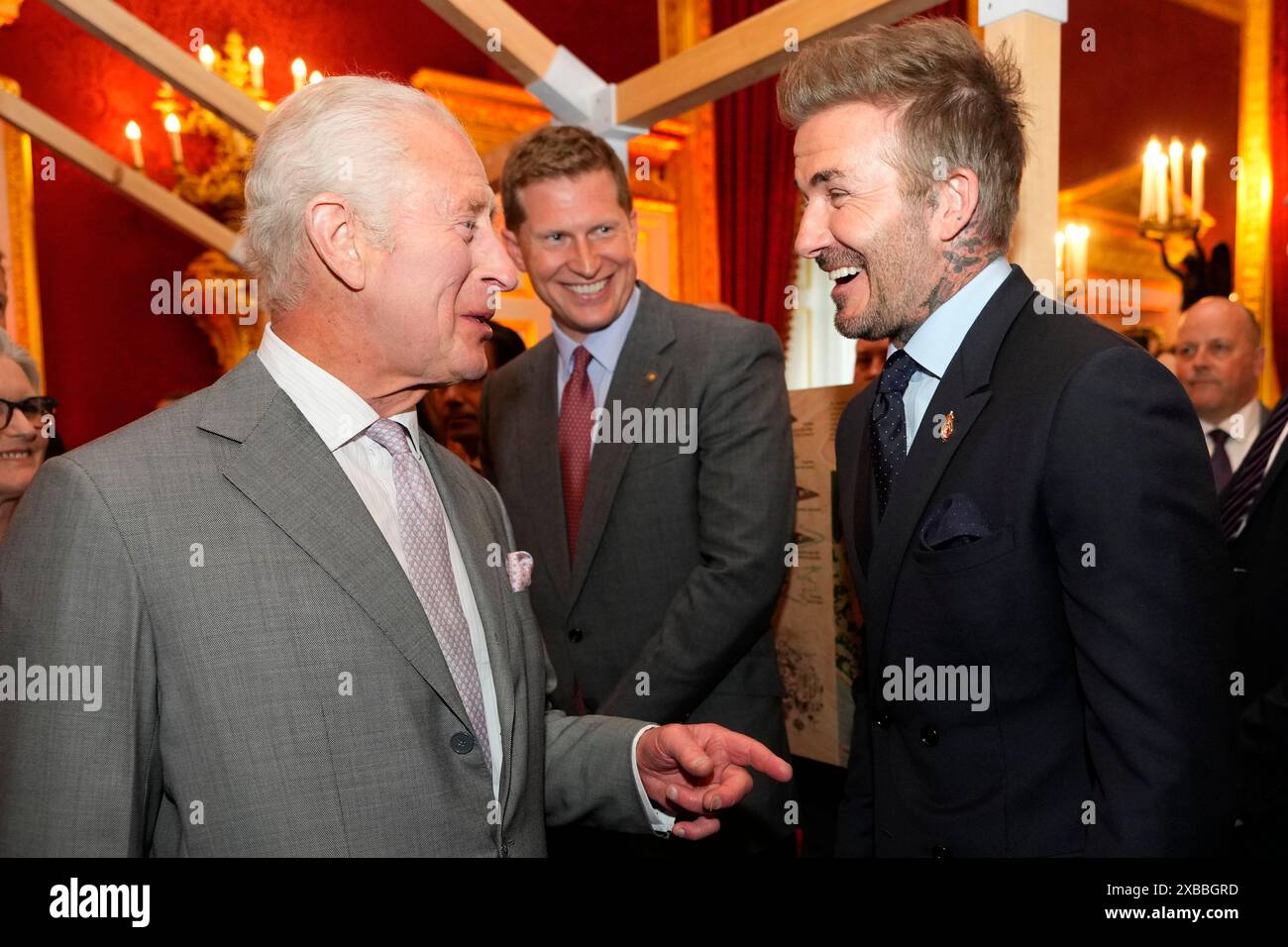 King Charles III (left) speaks to David Beckham as they attend the King's Foundation charity's ...