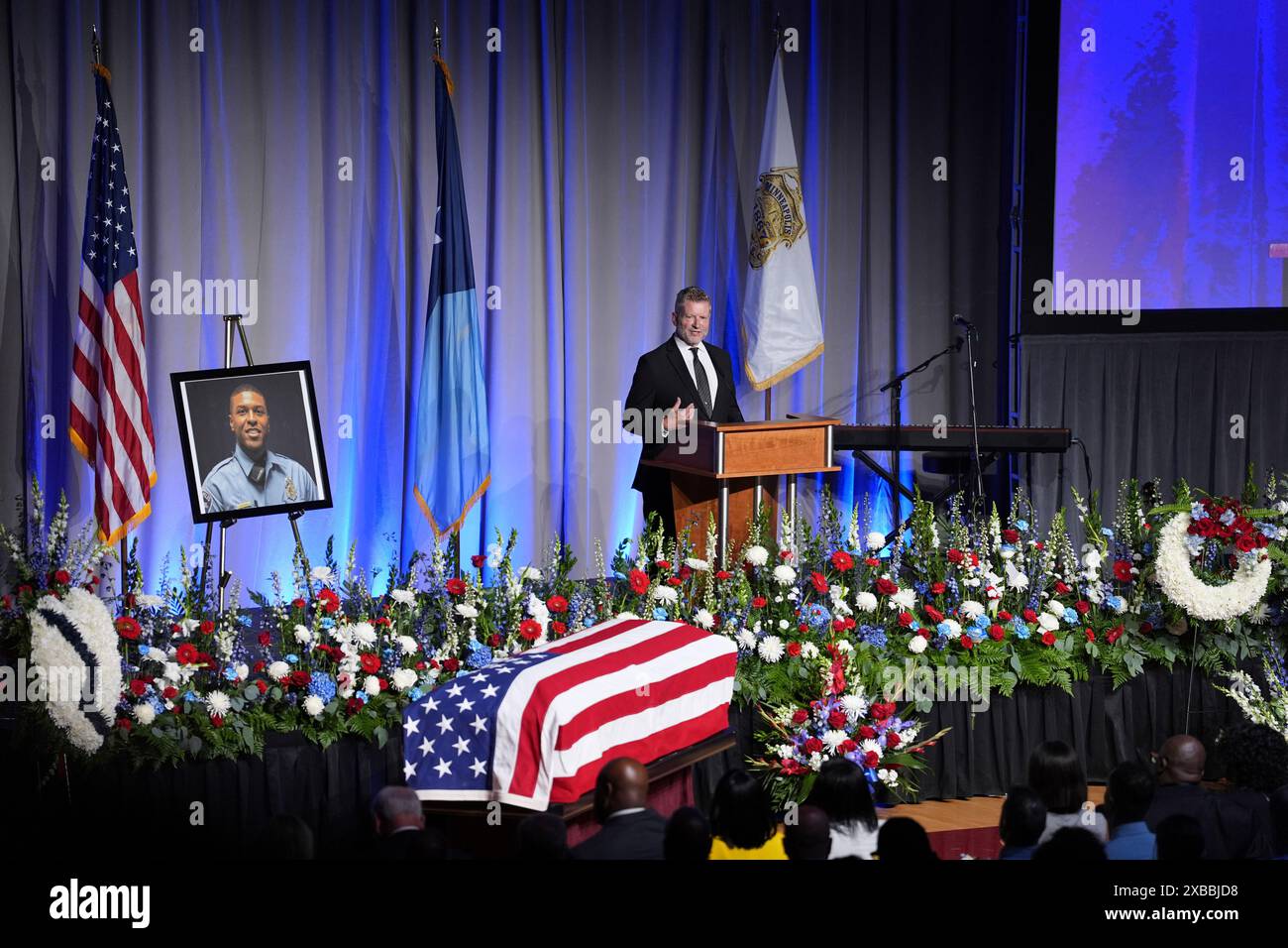 Pastor Mike Emmert speaks during a public memorial service for ...