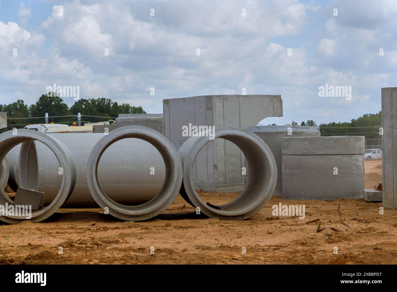 Stack of concrete drainage wells prior to installation on construction ...