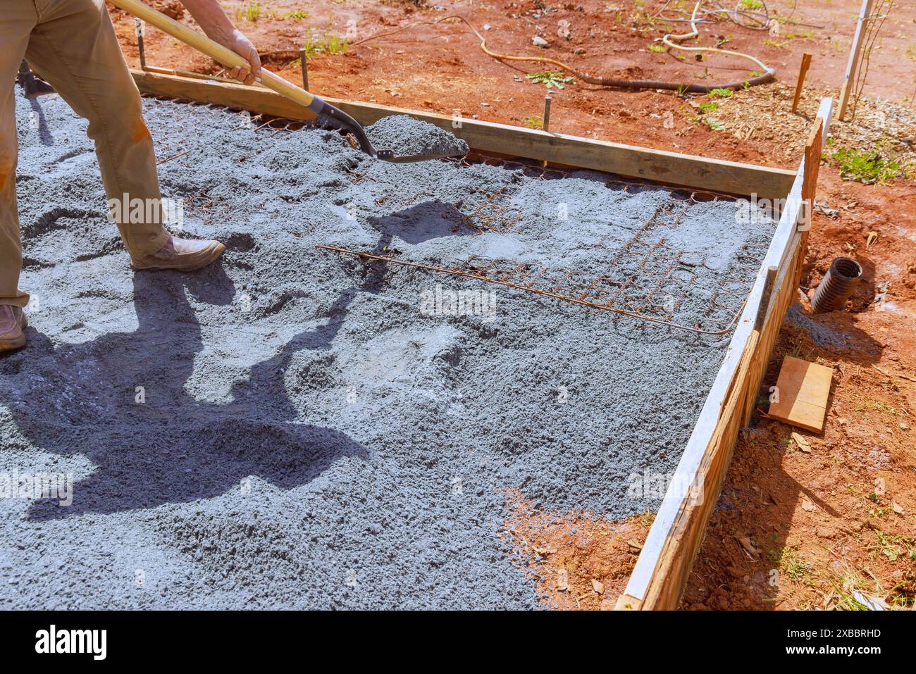 For purpose of pouring concrete into foundation for house, ground is ...