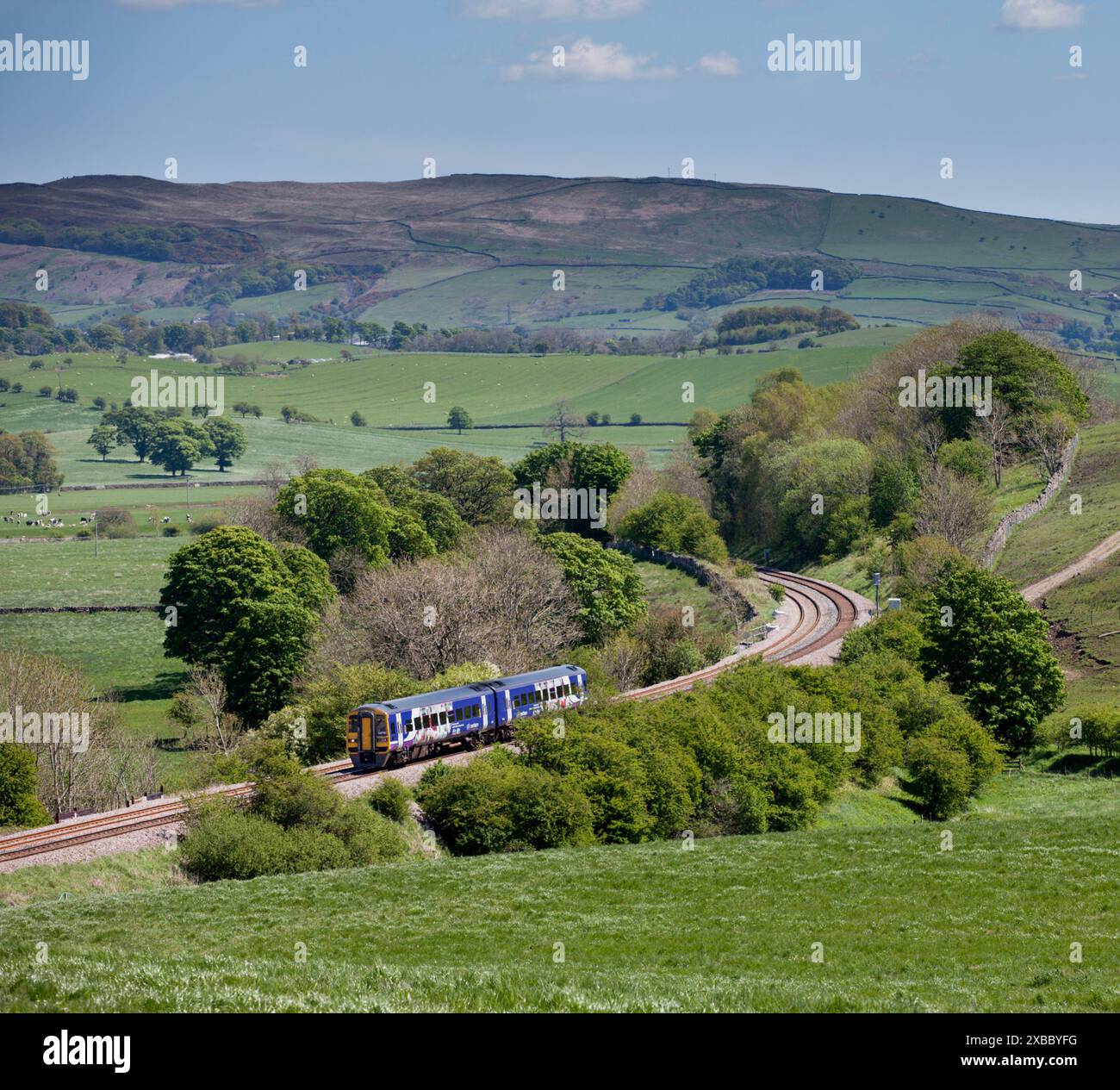 Northern Rail class 158 diesel train passing through the Aire valley countryside, Gargrave ...