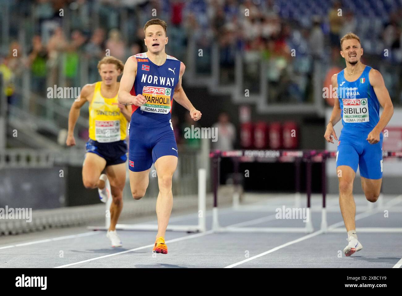 Karsten Warholm, of Norway, approaches the finish line to win the gold ...