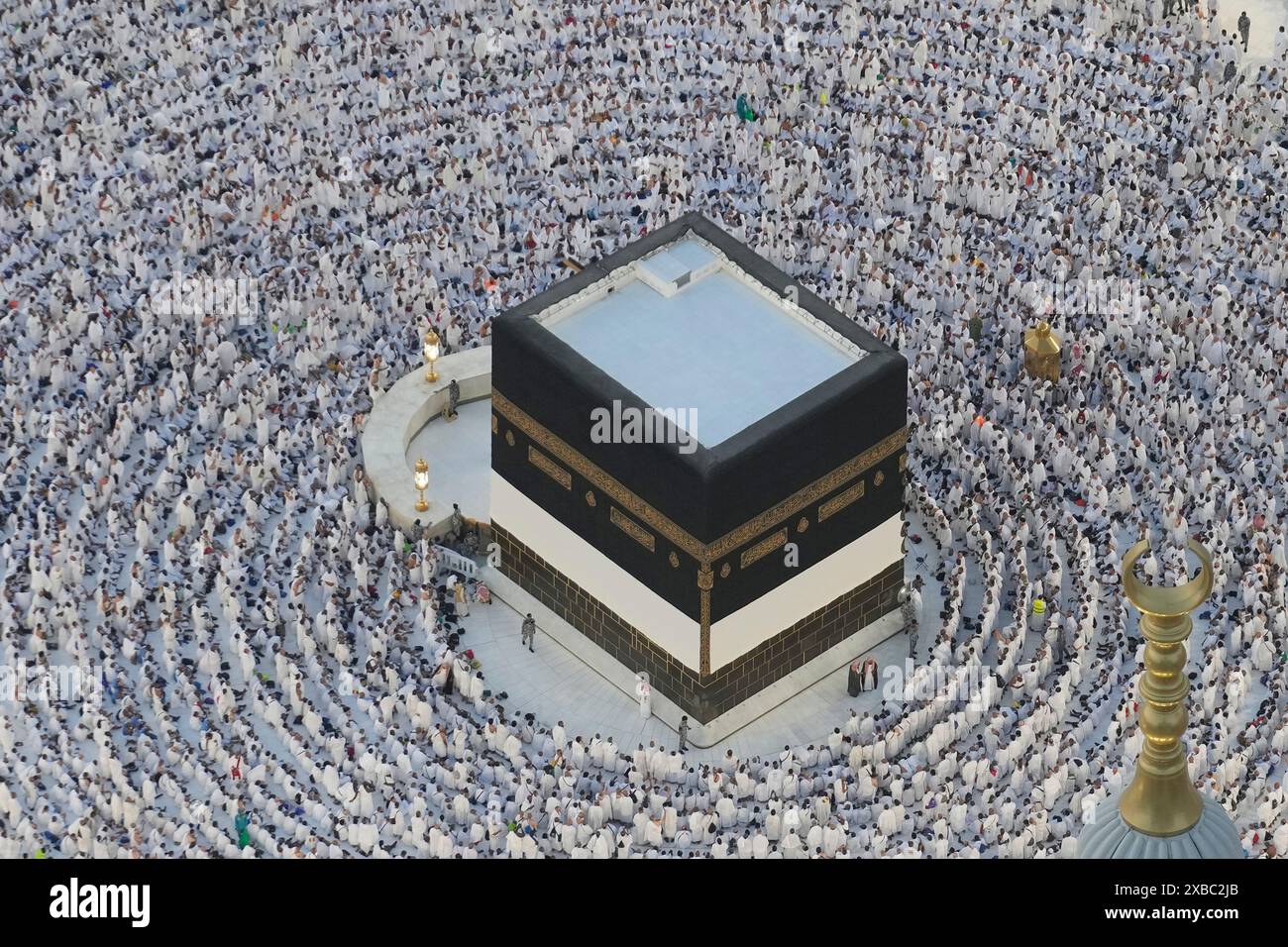 Muslim pilgrims circumambulate the Kaaba, the cubic building at the ...