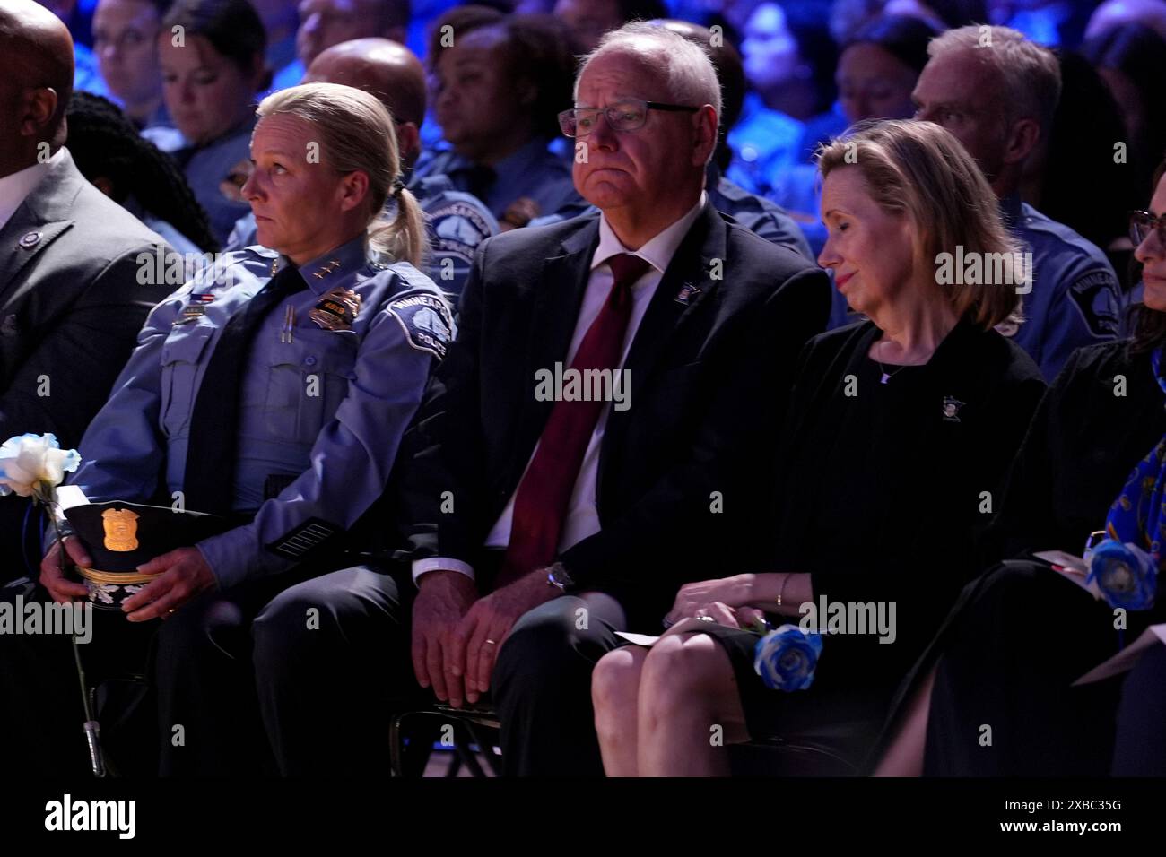 Minnesota Gov. Tim Walz, center, is seen in the audience during a ...