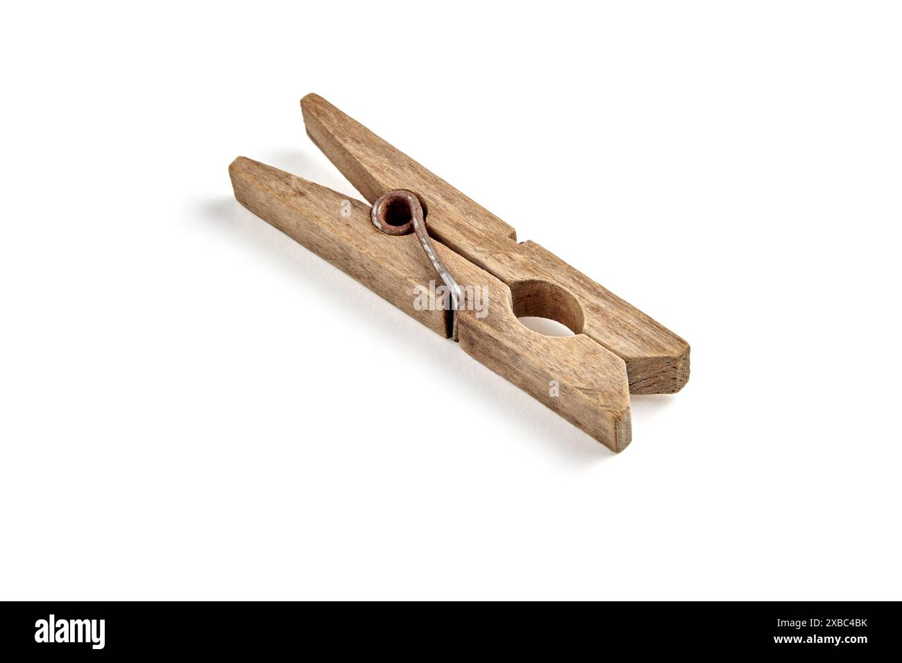 Wooden clothespin with rusty spring isolated on white background Stock ...