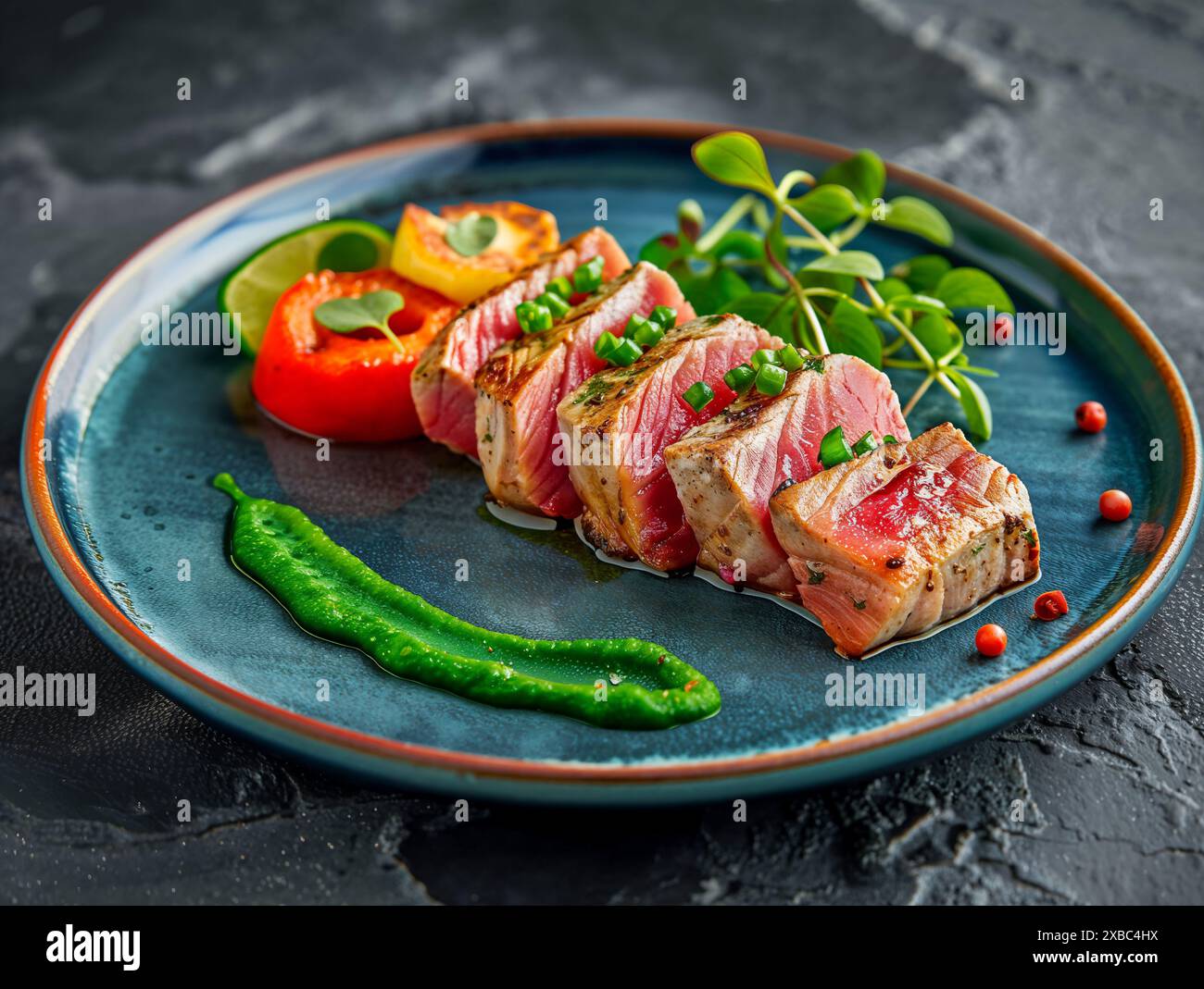 Tuna with steamed vegetables food in modern ceramic plate on slate ...