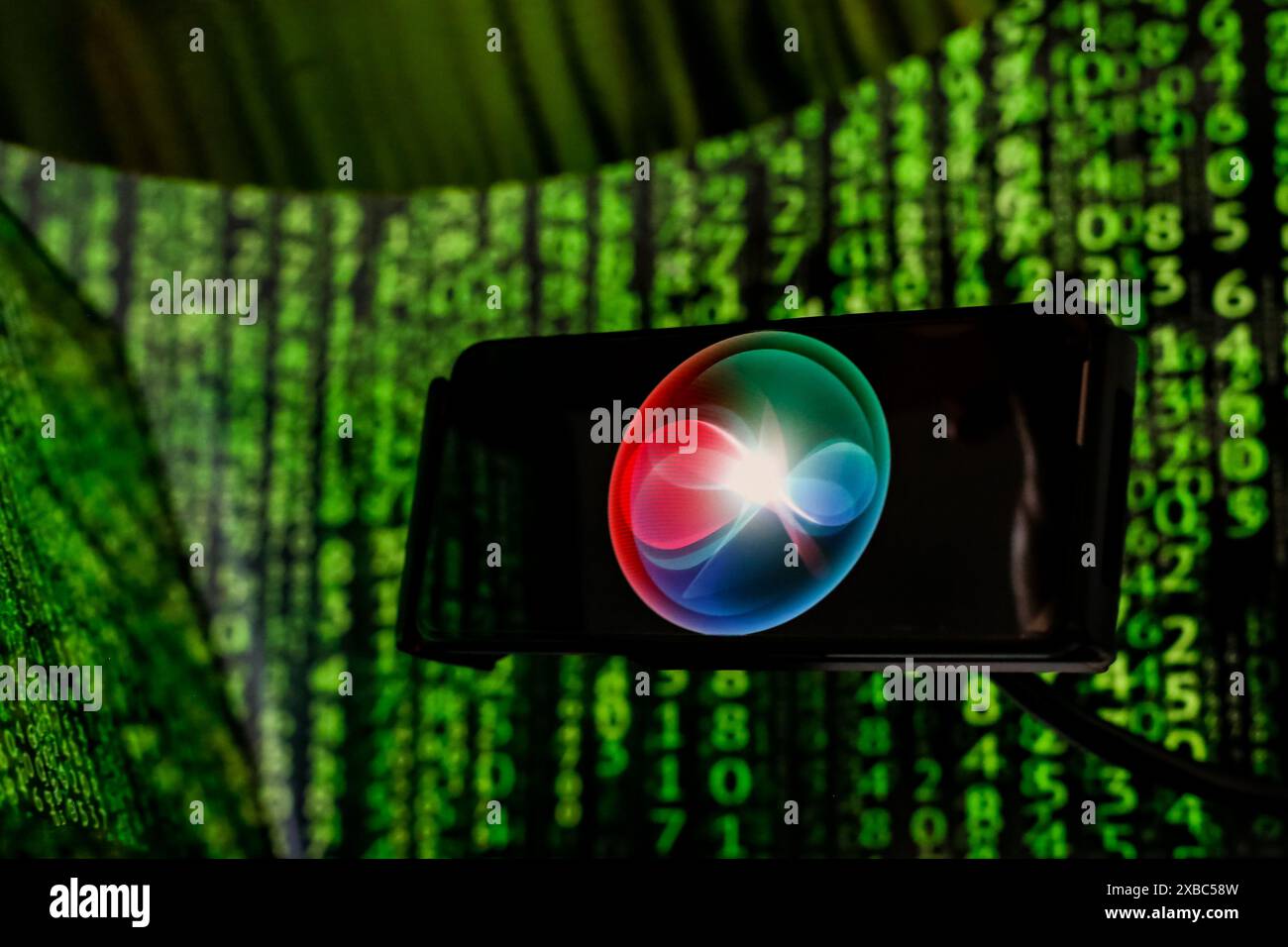 In this photo illustration, the Siri logo is seen displayed on a ...