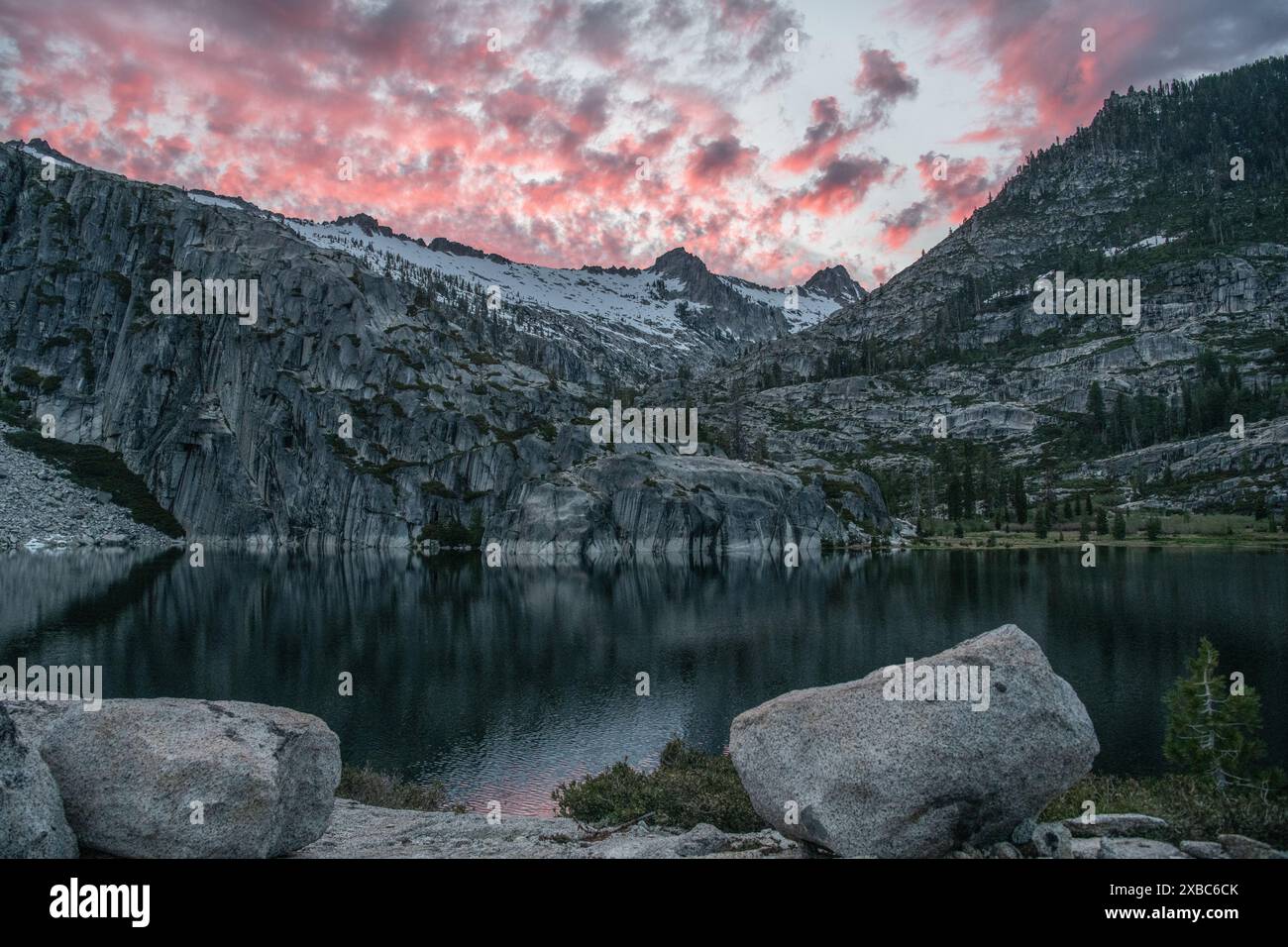 A high elevation lake at sunset in the Shasta Trinity Alps wilderness ...