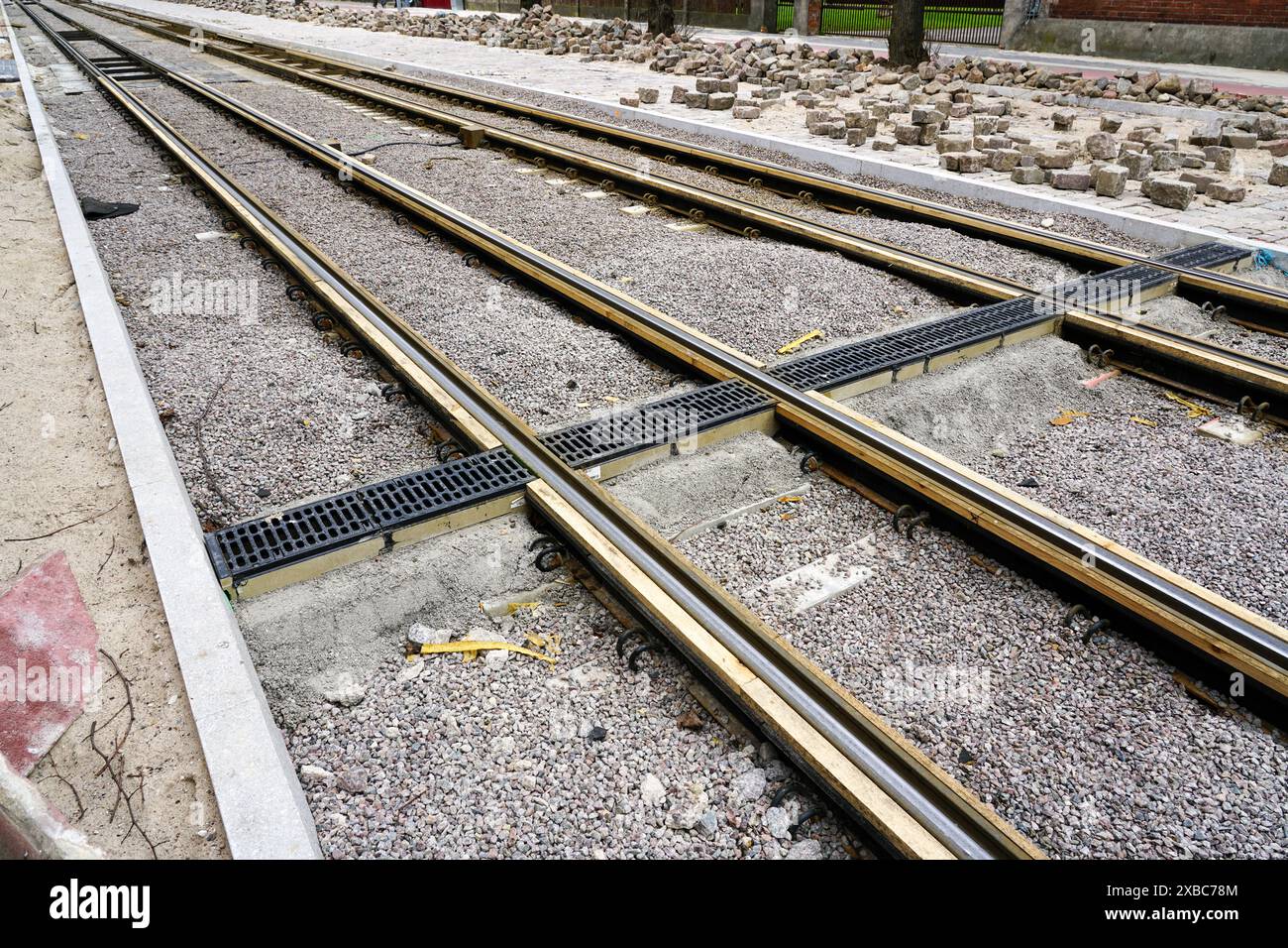 Installing a rainwater drain between the tram tracks during rails ...