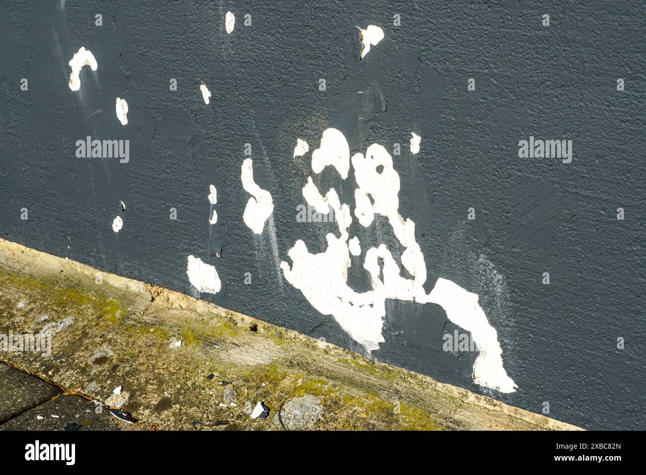 Delamination the facade wall paint layer from the wall due to poor ...