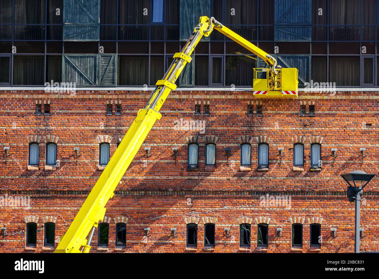Facade maintenance works of a historic house using a self propelled ...