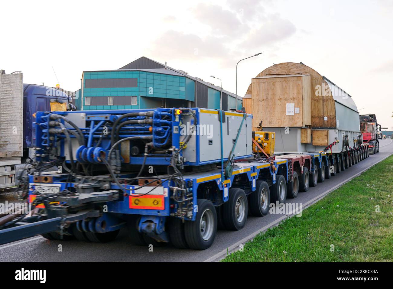 Very long specialized multi axle truck trailer carries very heavy ...