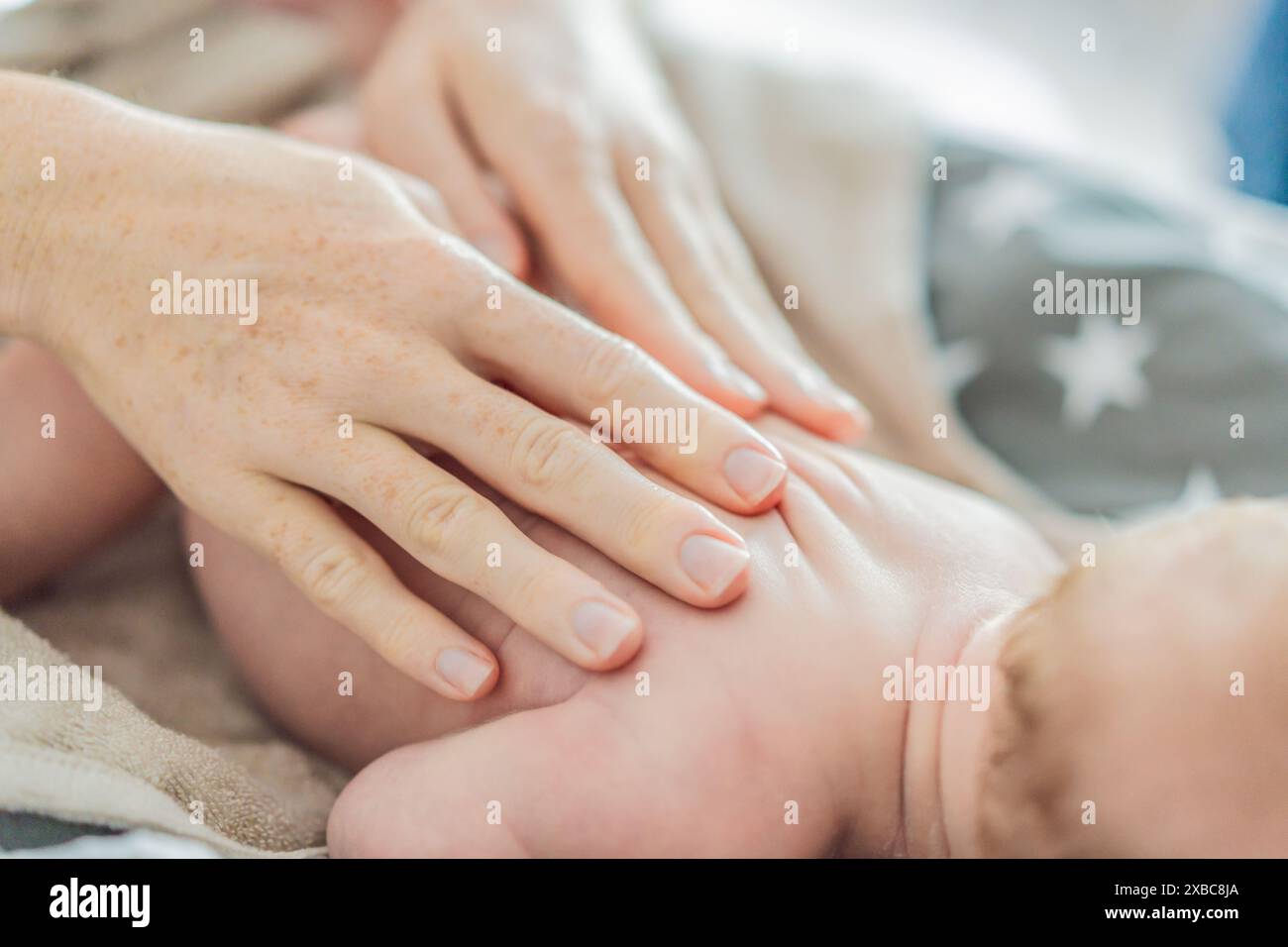 The newborn's skin is peeling. Mom uses skin products and massages to ...
