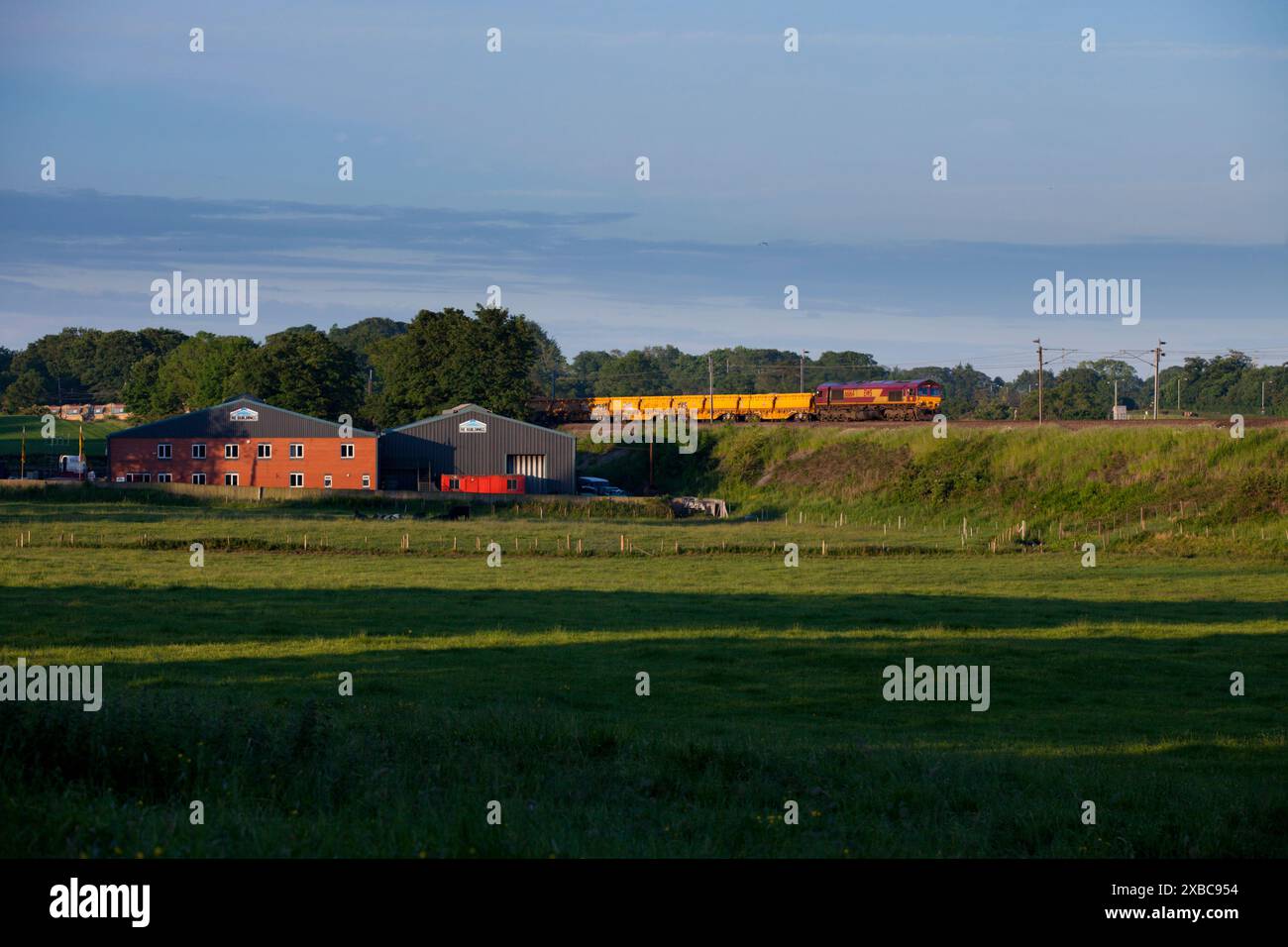 DB Schenker class 66 diesel locomotive in EWS livery hauling freight a ...