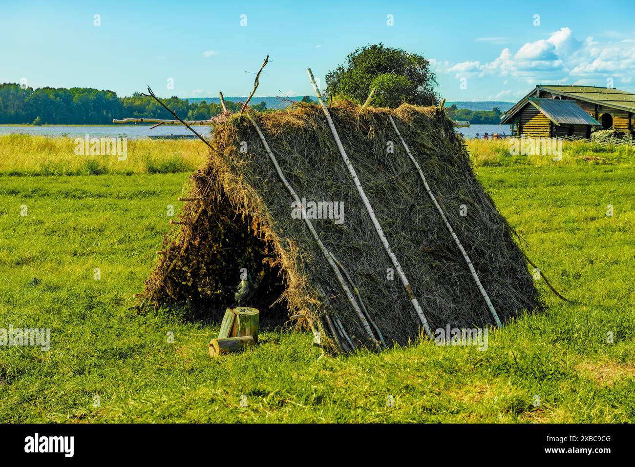 Landscape with huts covered with hay Stock Photo - Alamy