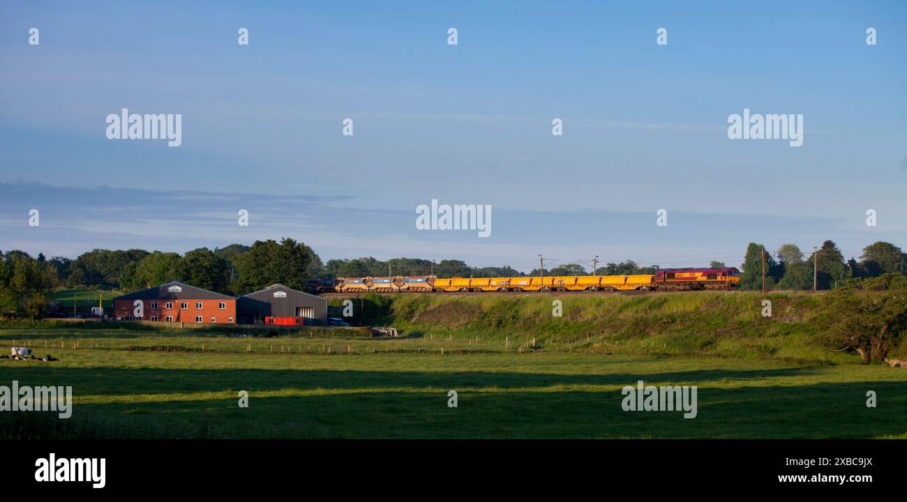 DB Schenker class 66 diesel locomotive in EWS livery hauling freight a ...
