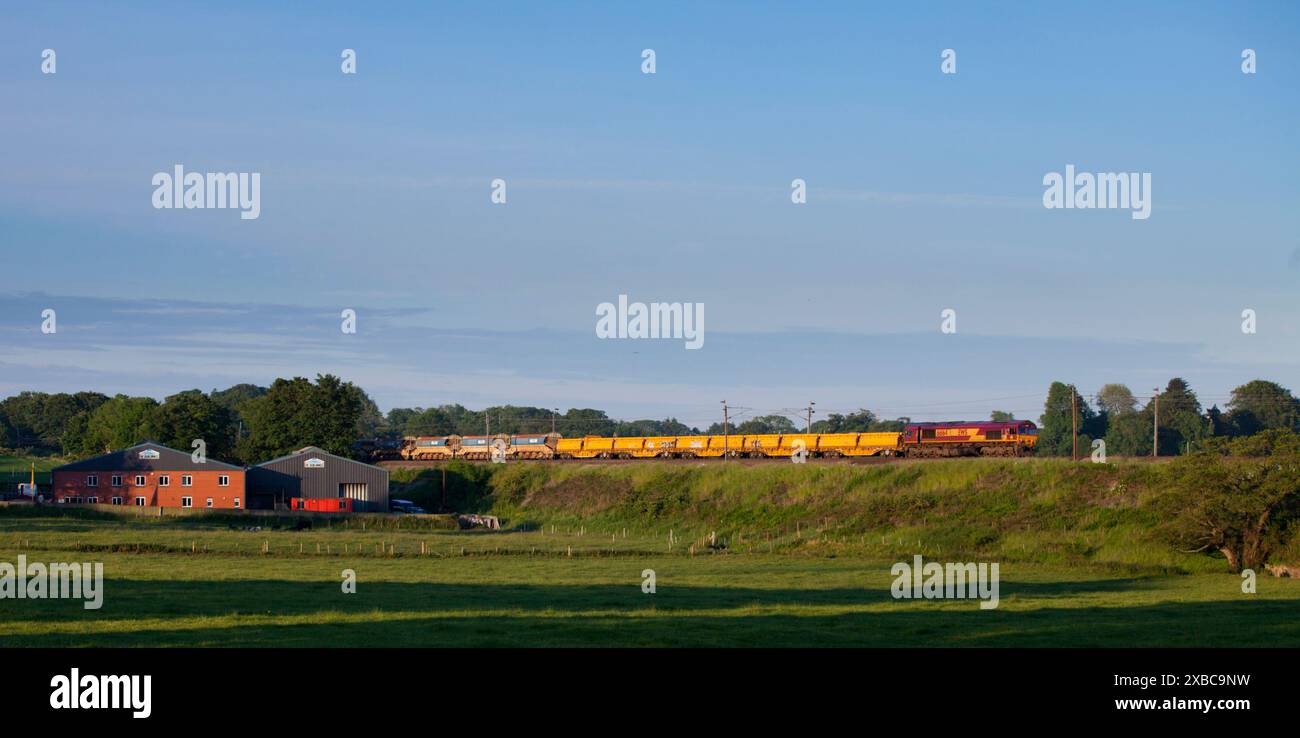 DB Schenker class 66 diesel locomotive in EWS livery hauling freight a ...