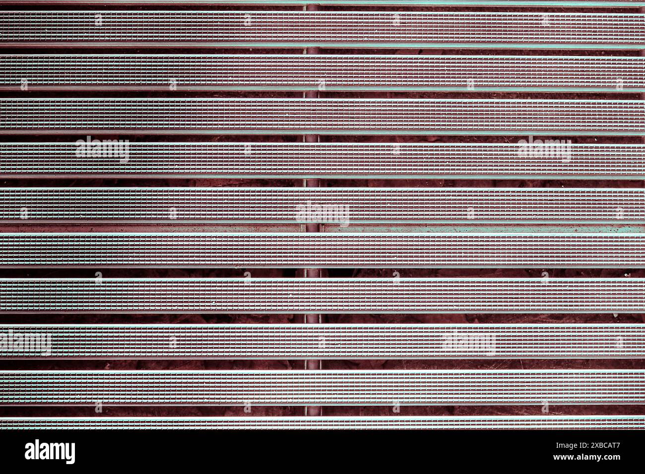 Metal grill with horizontal lines creating a repetitive pattern ...