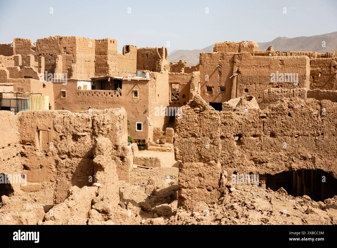 The ruins of an ancient mud brick kasbah and ksar in Tamnougalt ...