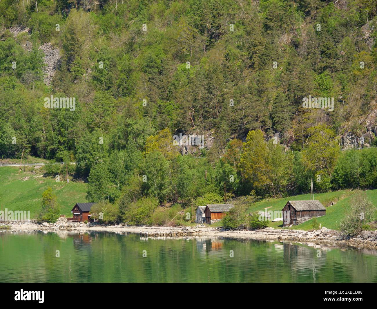 Three small wooden houses in an idyllic, green and rural setting by the ...