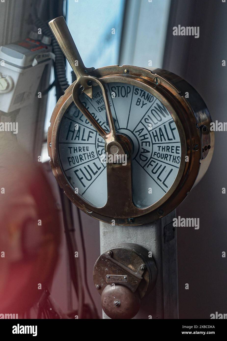 Close-up of a vintage ship's engine order telegraph with brass and ...
