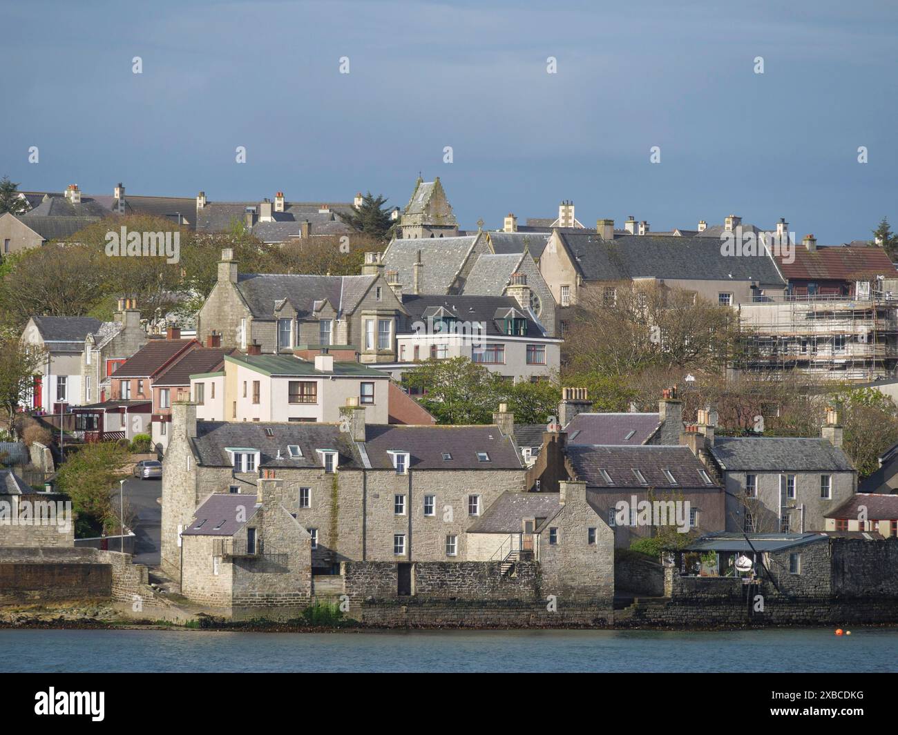 A quiet waterside town with traditional stone and timber houses ...