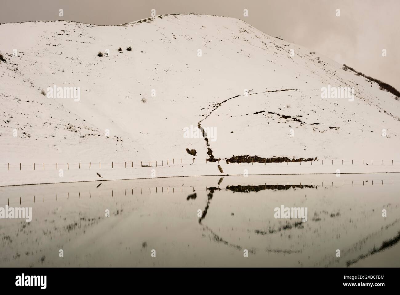 After snowfall in May: Riezler Alpsee, an artificial lake, snow pond ...
