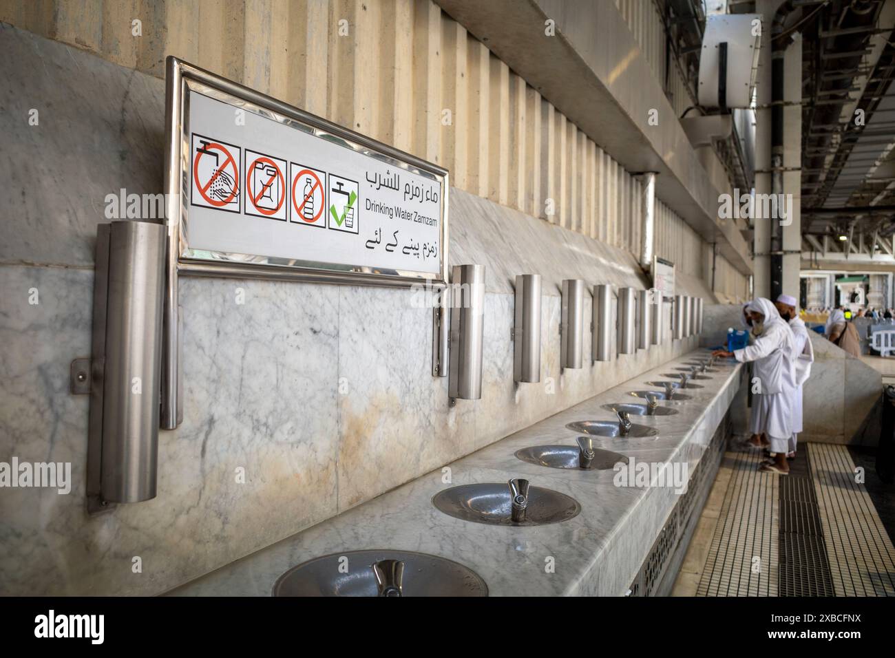Mecca, Saudi Arabia - June 1, 2024: Hajj and Umrah pilgrims drinking ...