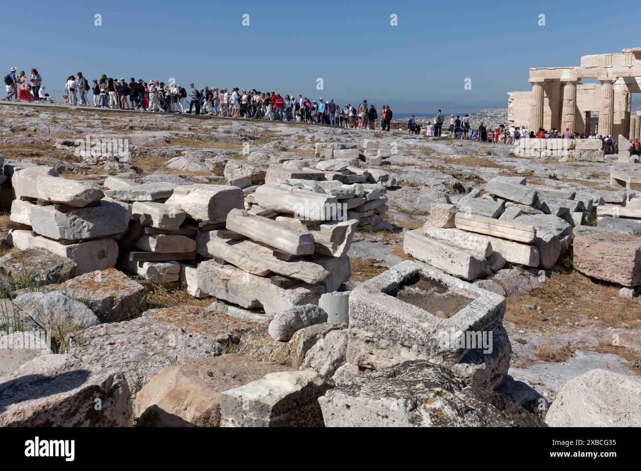 Queue of tourists on the way between Propylaea and Parthenon, in front ...