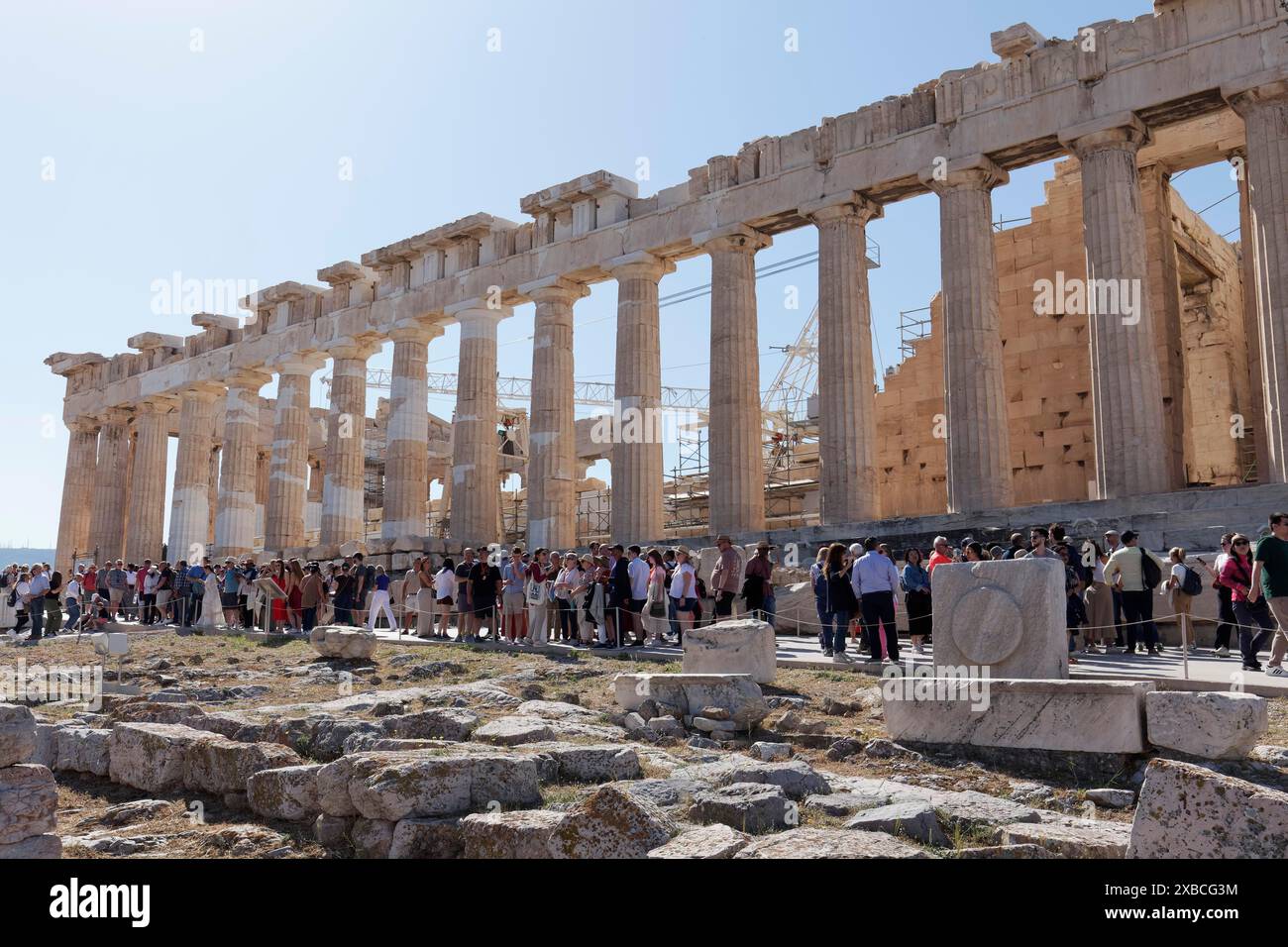 Parthenon north facade, in front of it many tourists, temple with Doric columns, Acropolis ...