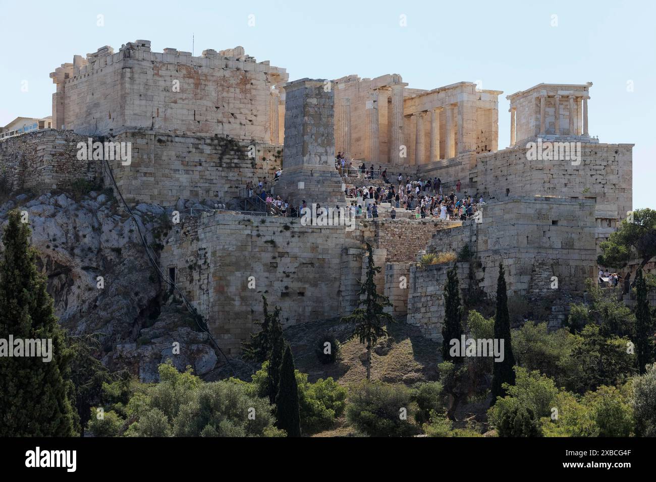Propylaea and Temple of Athena Nike, tourists climbing the Grand ...