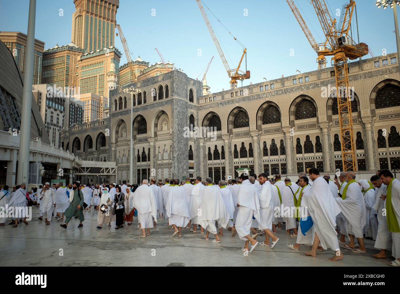 Mecca, Saudi Arabia - June 1, 2024: Hajj and Umrah pilgrims from around the world walking near ...