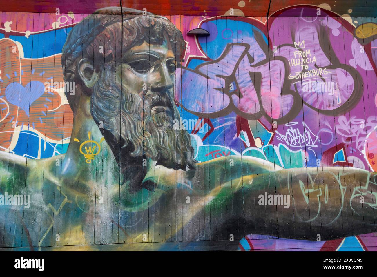 God of Greek mythology, Zeus, large graffiti on building fence, harbour ...