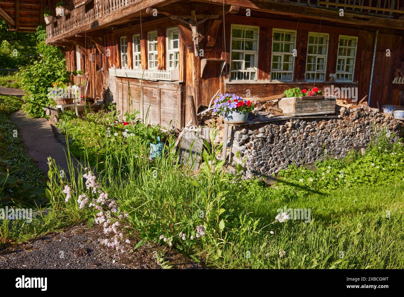 Details of an old Black Forest house with woodpile, windows and ...