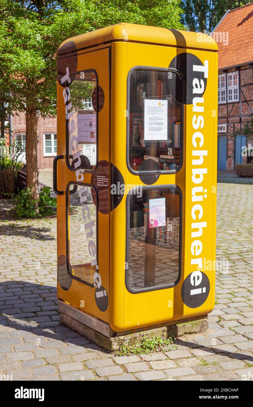 Old public telephone box converted into a swap book or book box ...