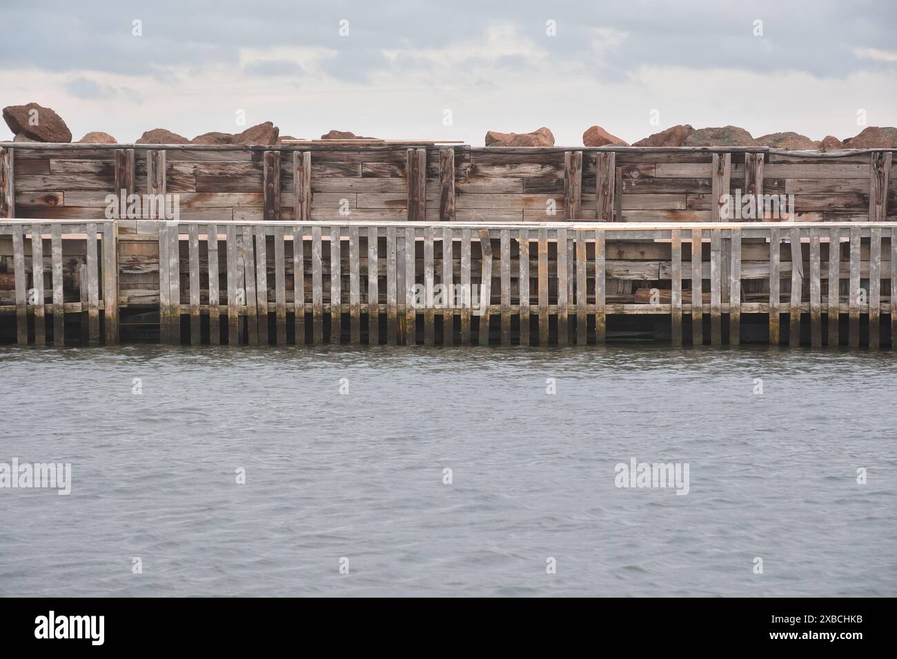 Weathered wood pier. Wood structure to protect boat Stock Photo - Alamy