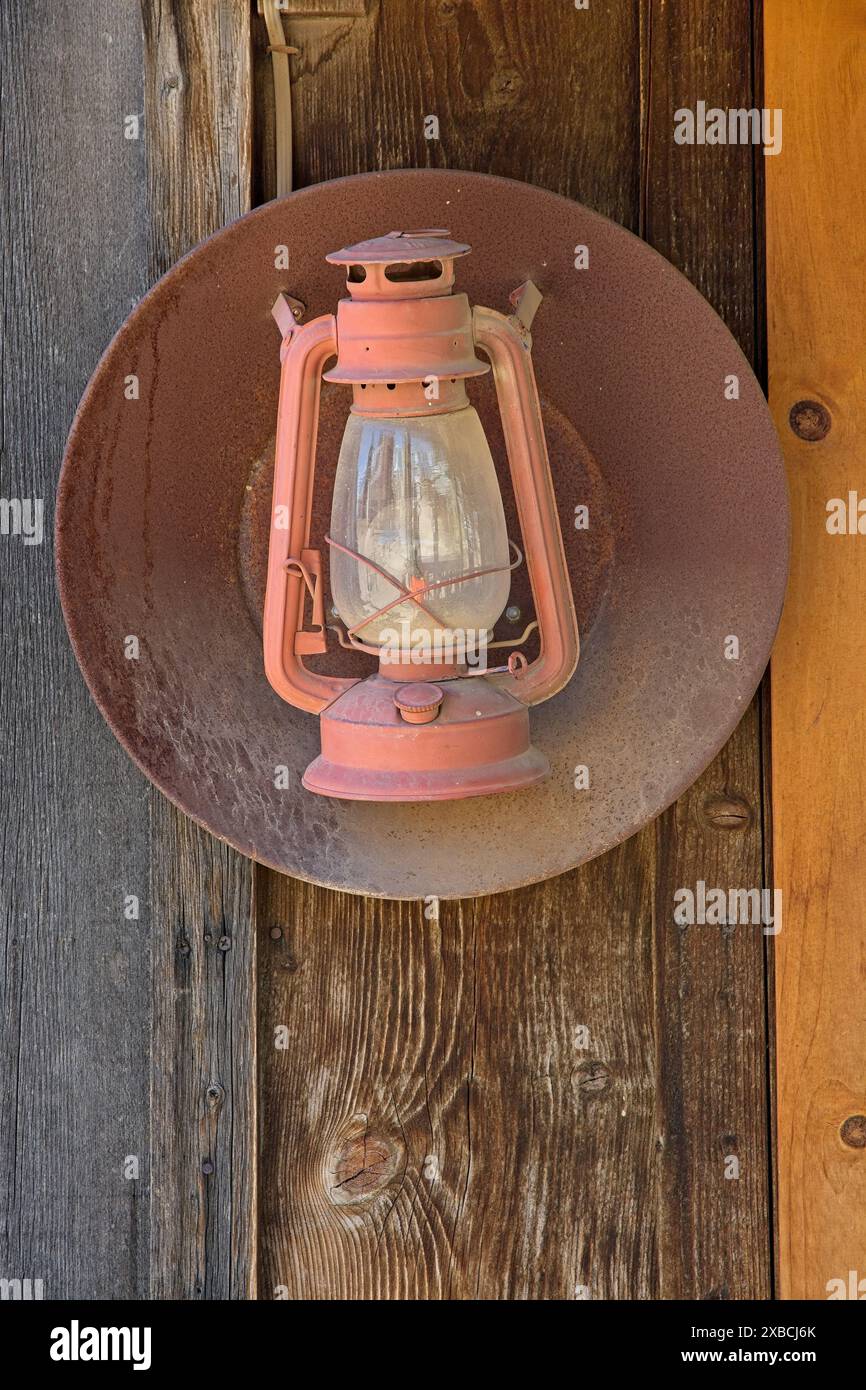 Miners lamp mounted on rustic wood plank wall in mining pan Stock Photo ...