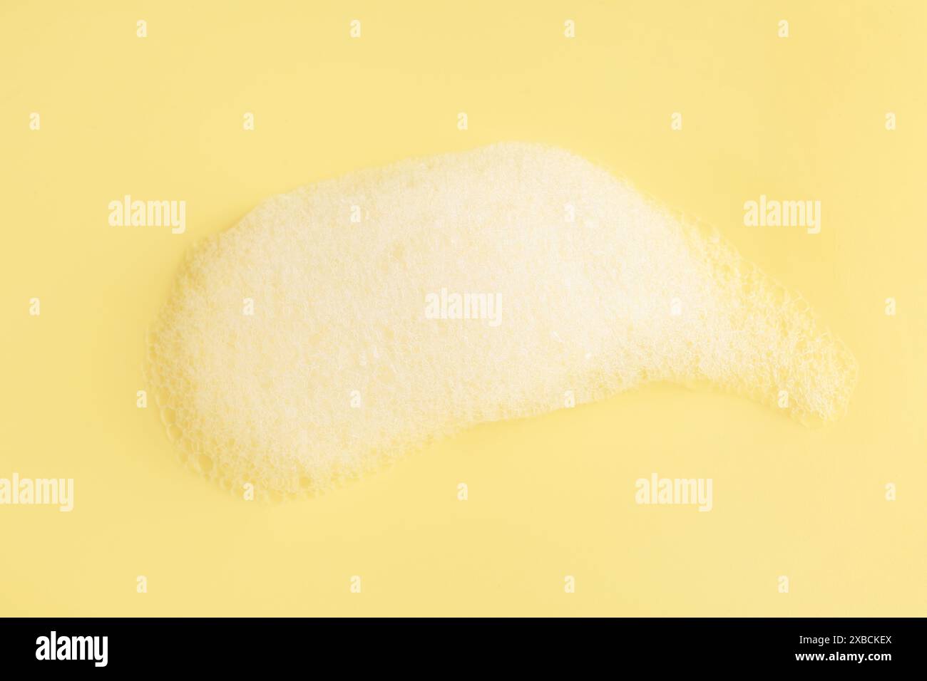 Sample of fluffy foam on yellow background, top view Stock Photo - Alamy