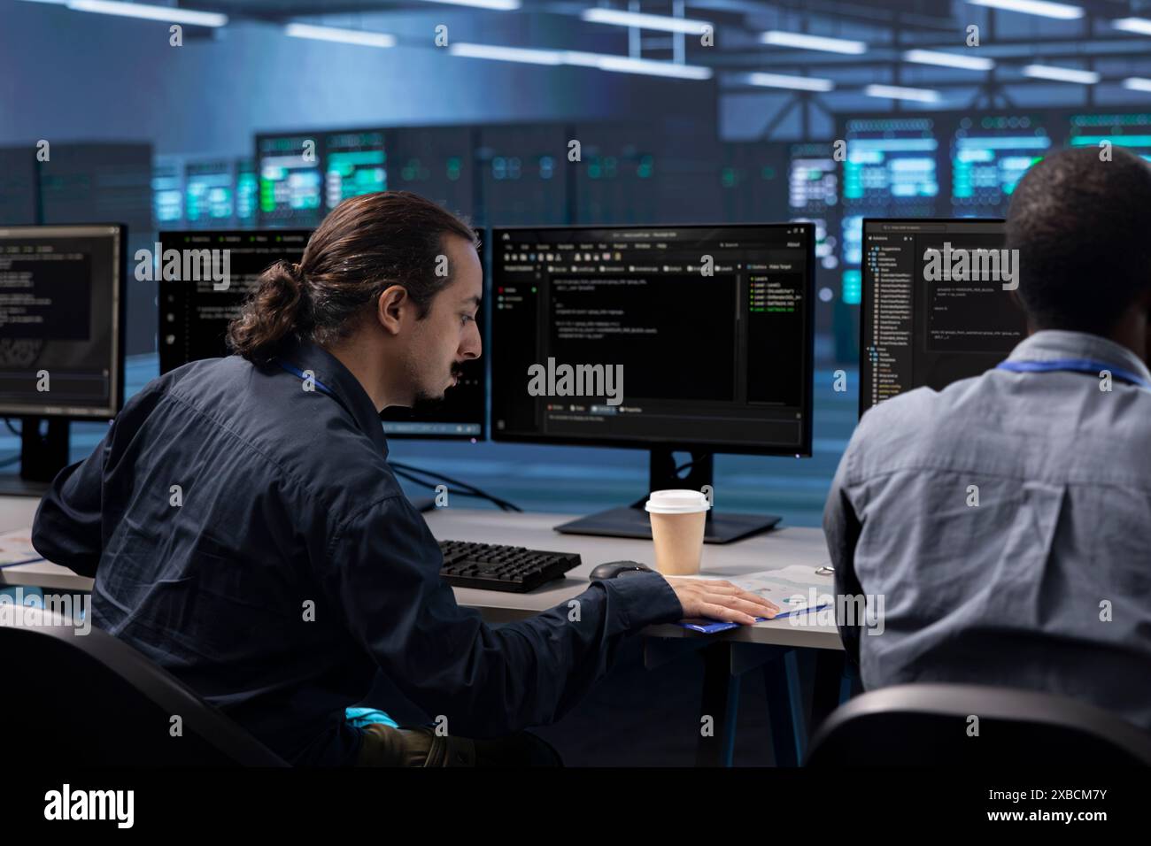 Coworkers in data center workspace running system diagnostic tests to ...