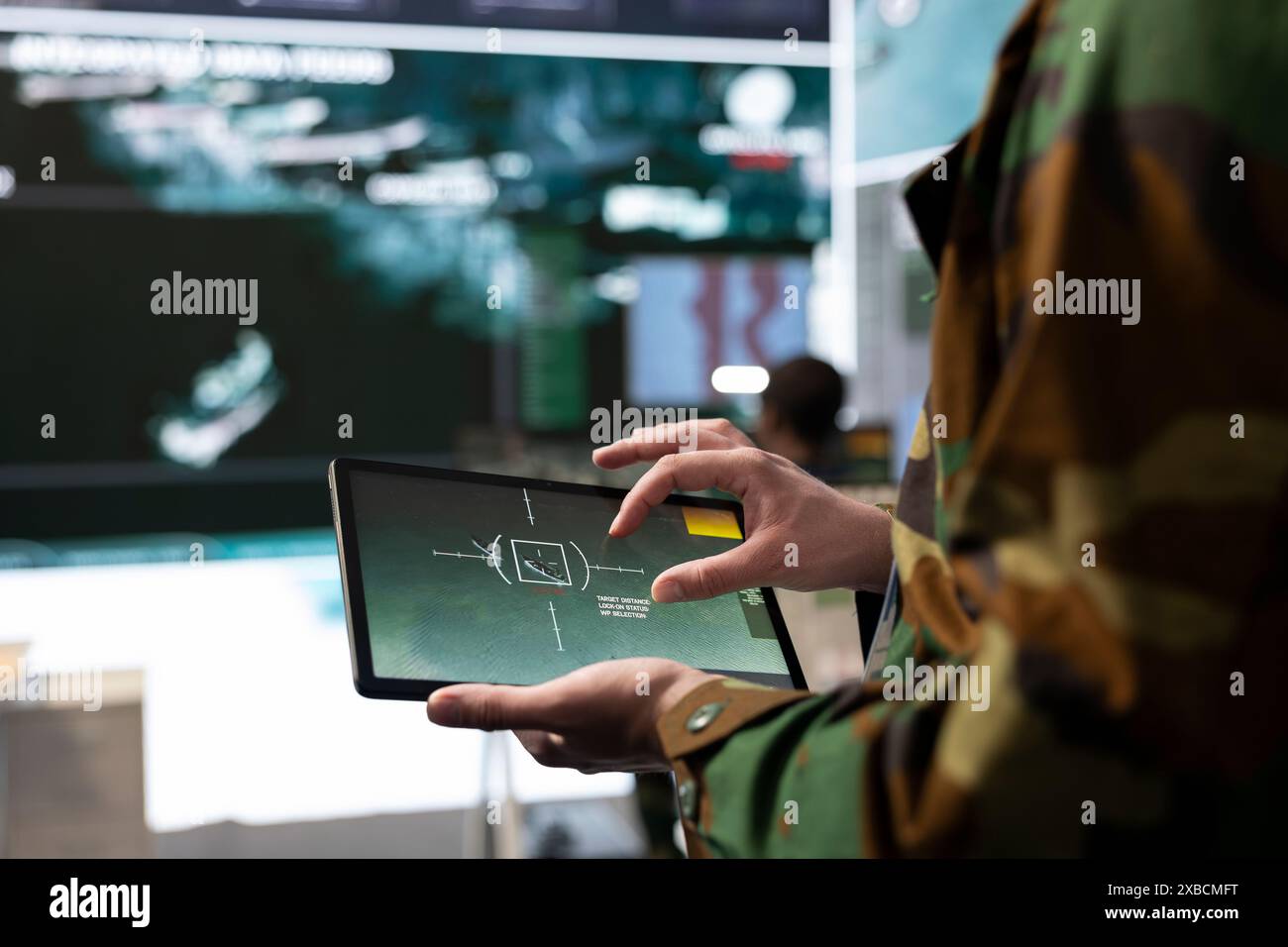 Military IT engineer collecting intelligence from world map projection ...