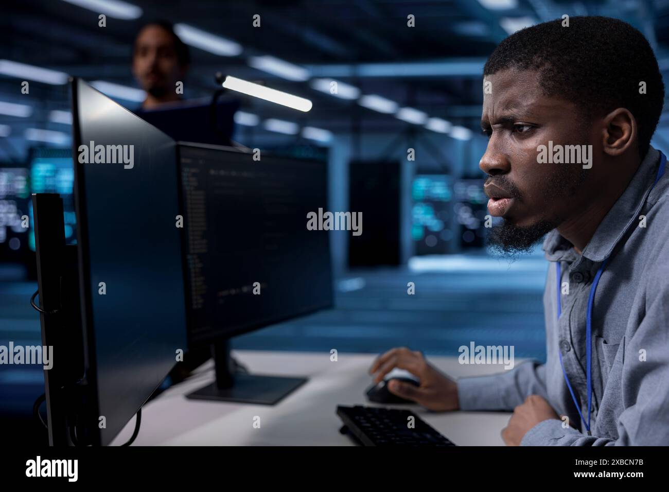 Server farm admin overseeing supercomputers hi-res stock photography ...