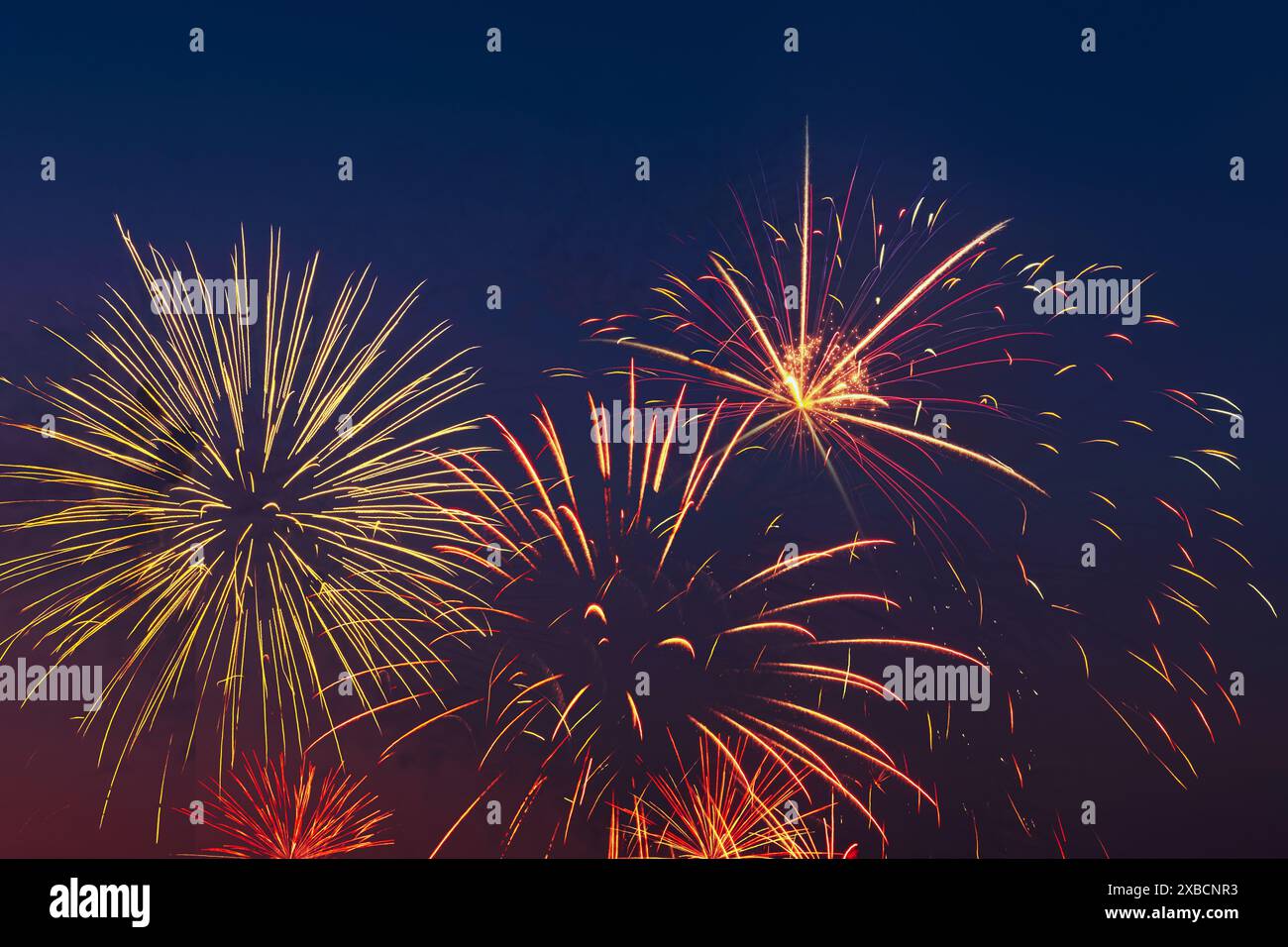 Colorful fireworks on night sky background. Celebration and holidays ...