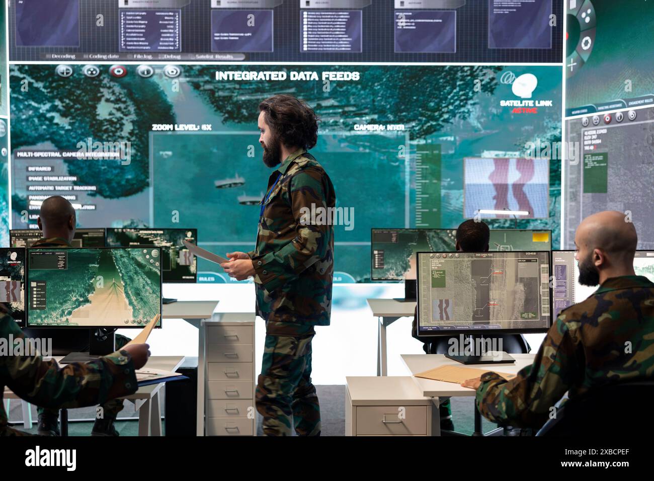 Trooper examining real time reconnaissance data on big screen in ...