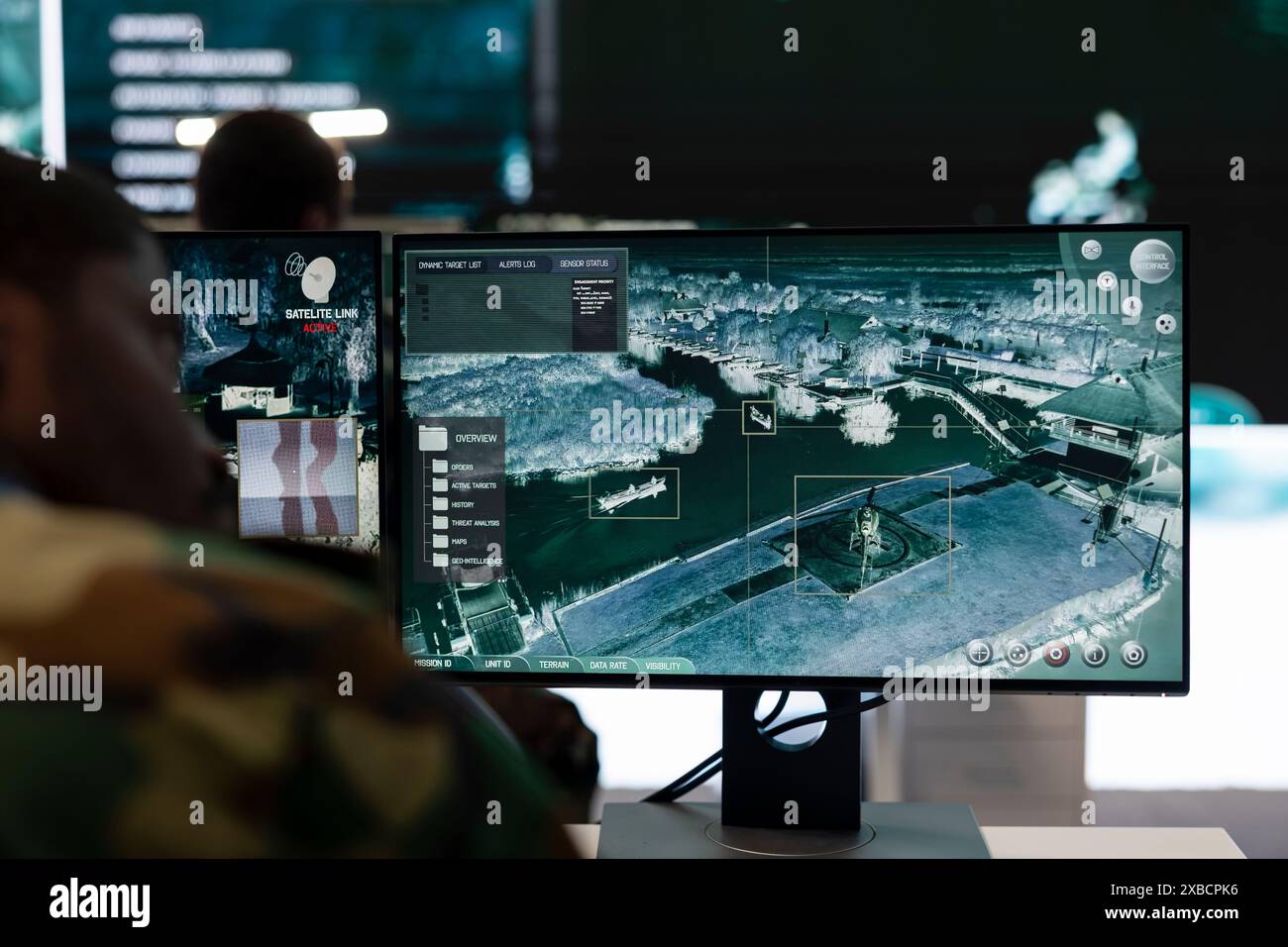 Recruit analyzes satellite radar CCTV footage in control room, monitoring the infantry unit ...