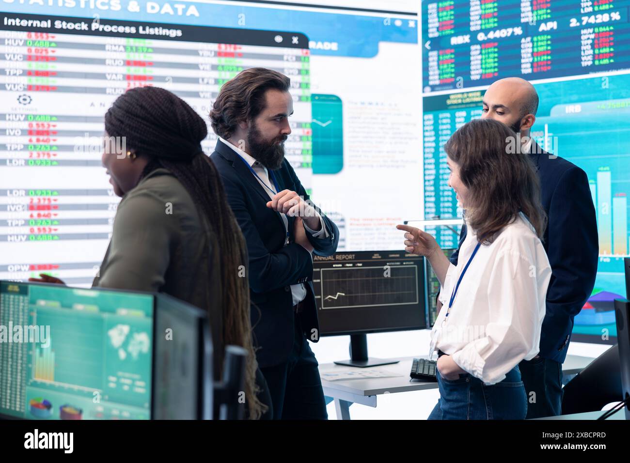 Staff members from a business enterprise discussing details and ...
