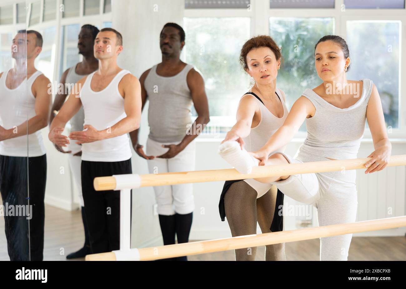 Ballet pose grand batman - ballet troupe of different nationalities at ...