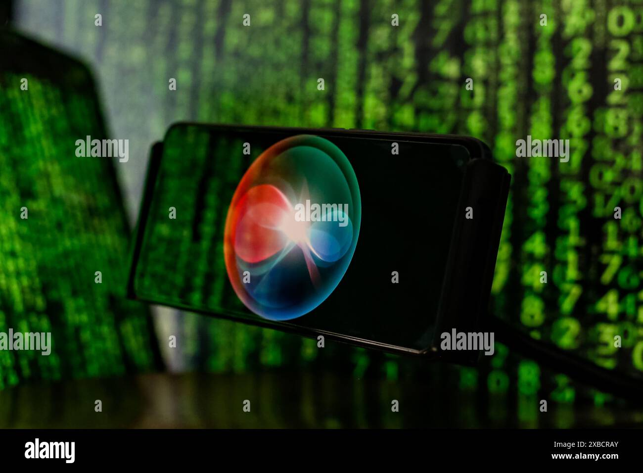 In this photo illustration, the Siri logo is seen displayed on a ...