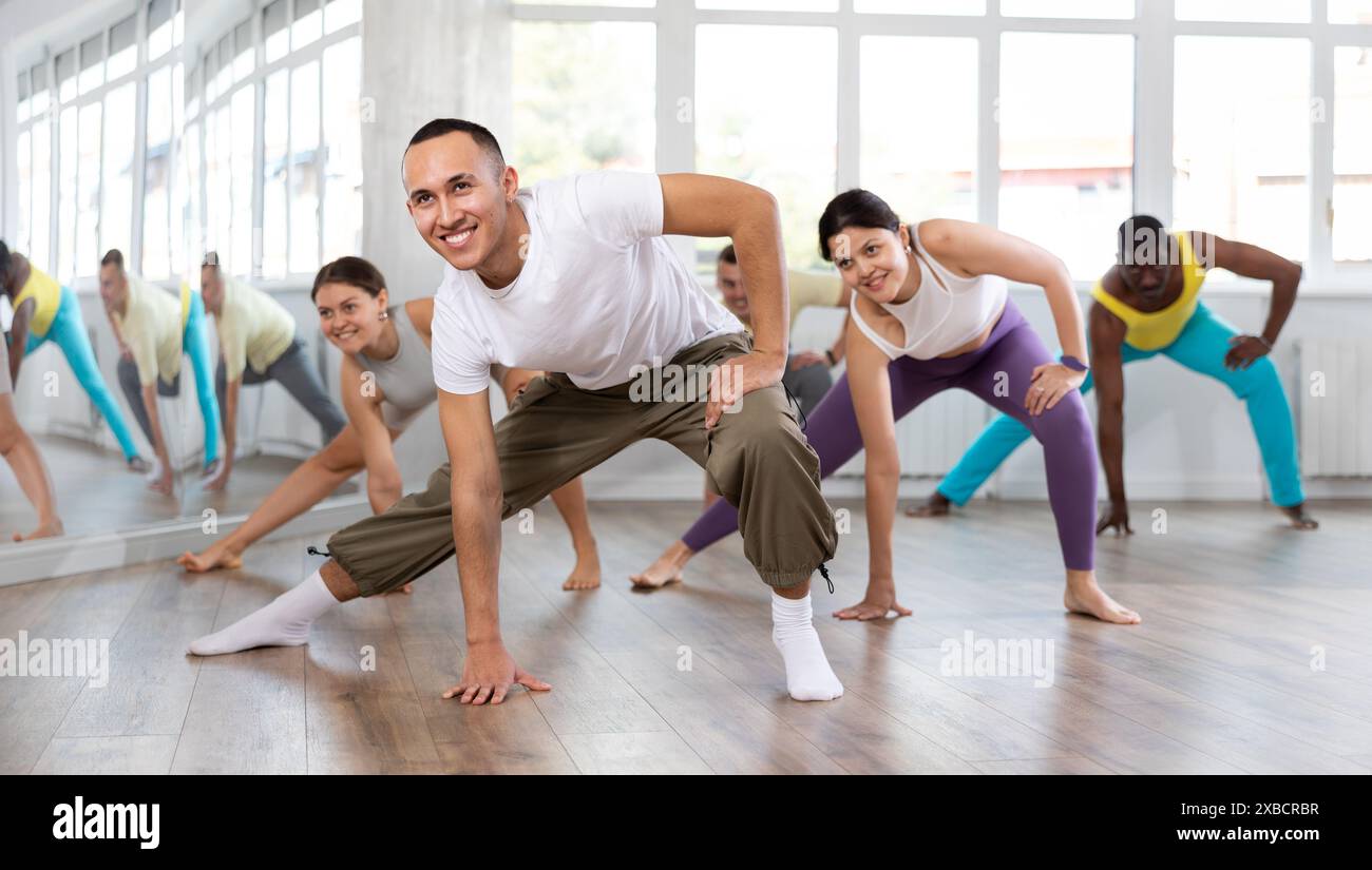 European guy with team of like-minded multinational people learn to ...