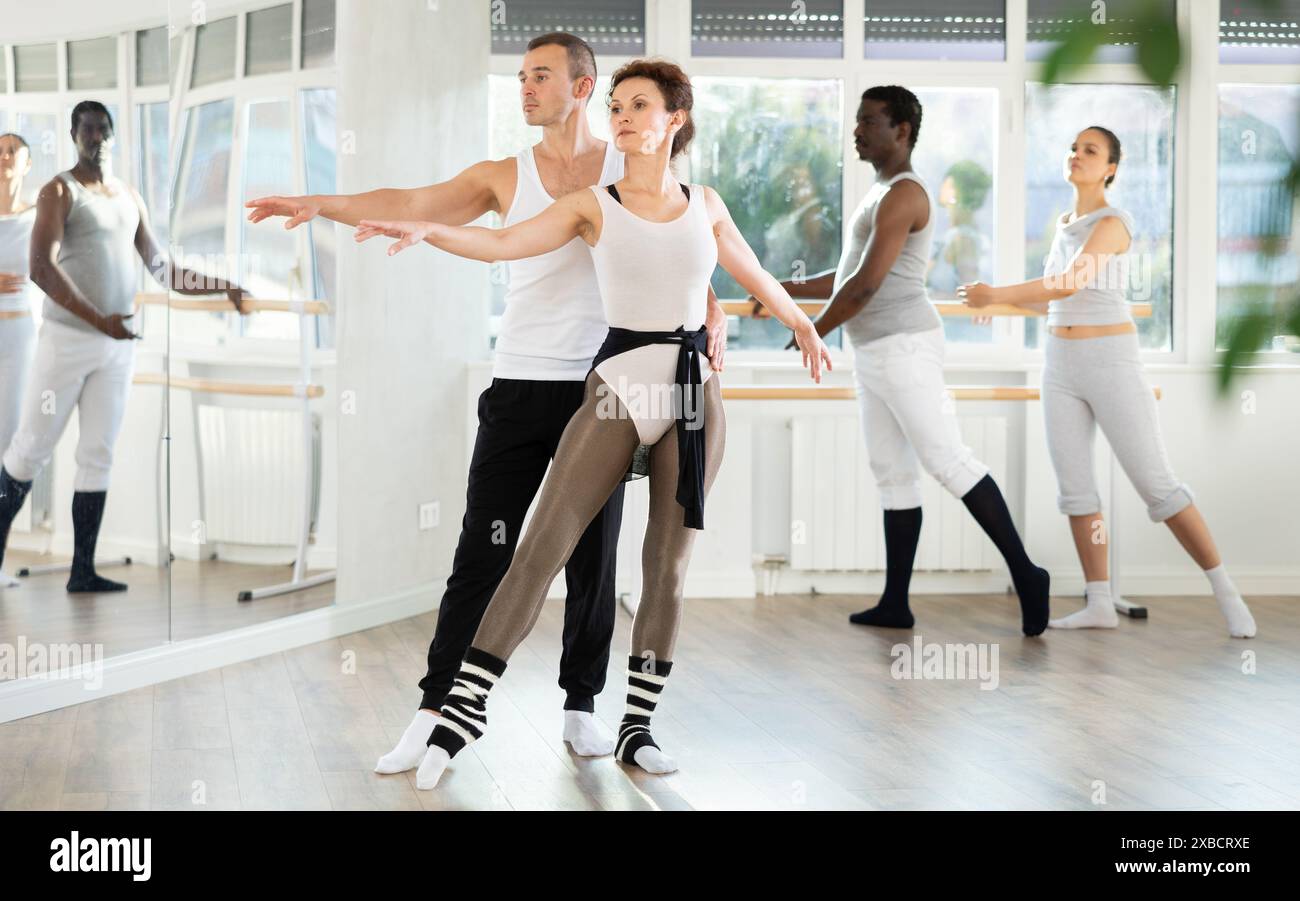 Young man and adult woman rehearsing pair ballet Stock Photo - Alamy