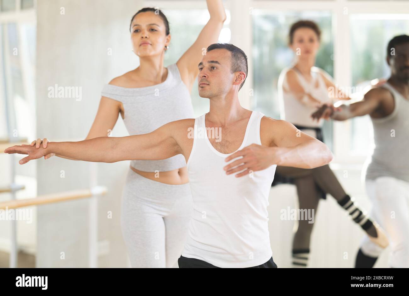 Man and girl woman together arabesque position of ballet during ...